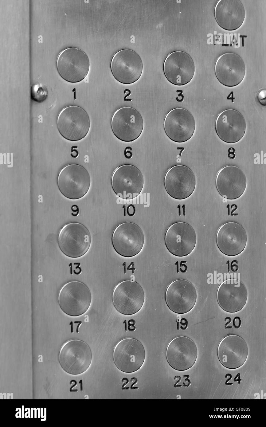 Push buttons outside large block of flats with numbers Stock Photo - Alamy