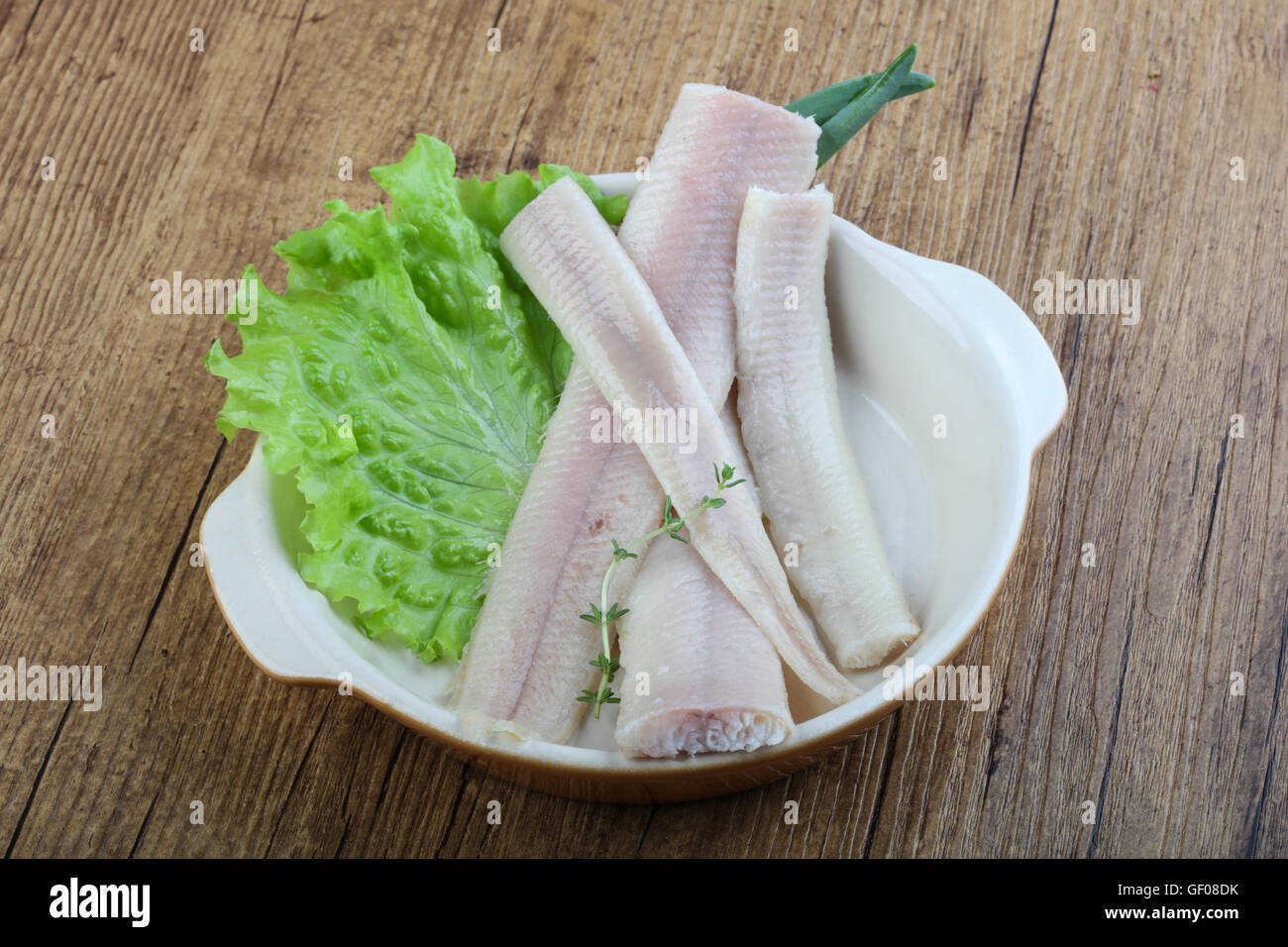 Eel fillet smoked with onion and salad leves Stock Photo - Alamy