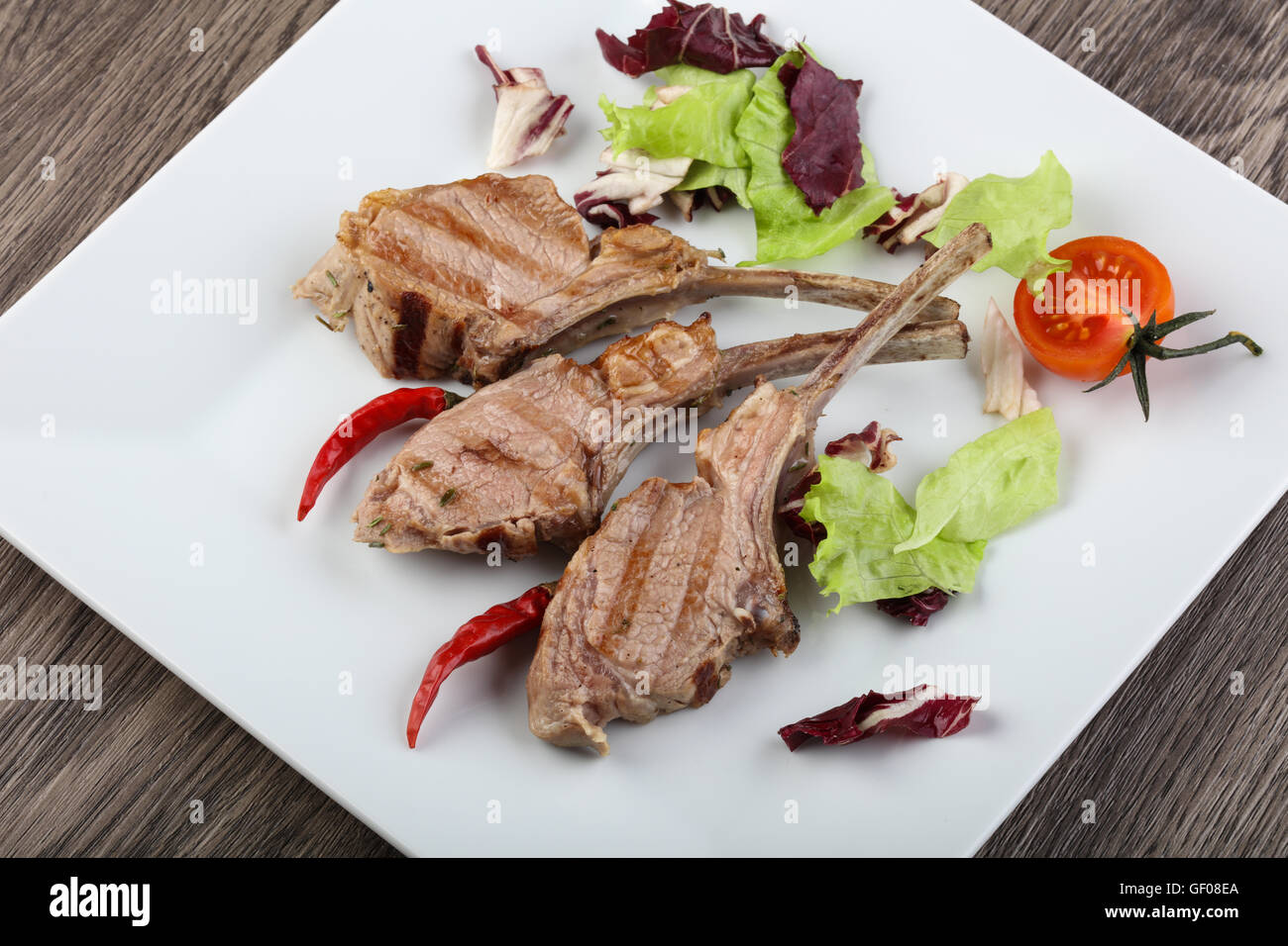 Lamb Frenched Rack grilled rib bone Stock Photo - Alamy