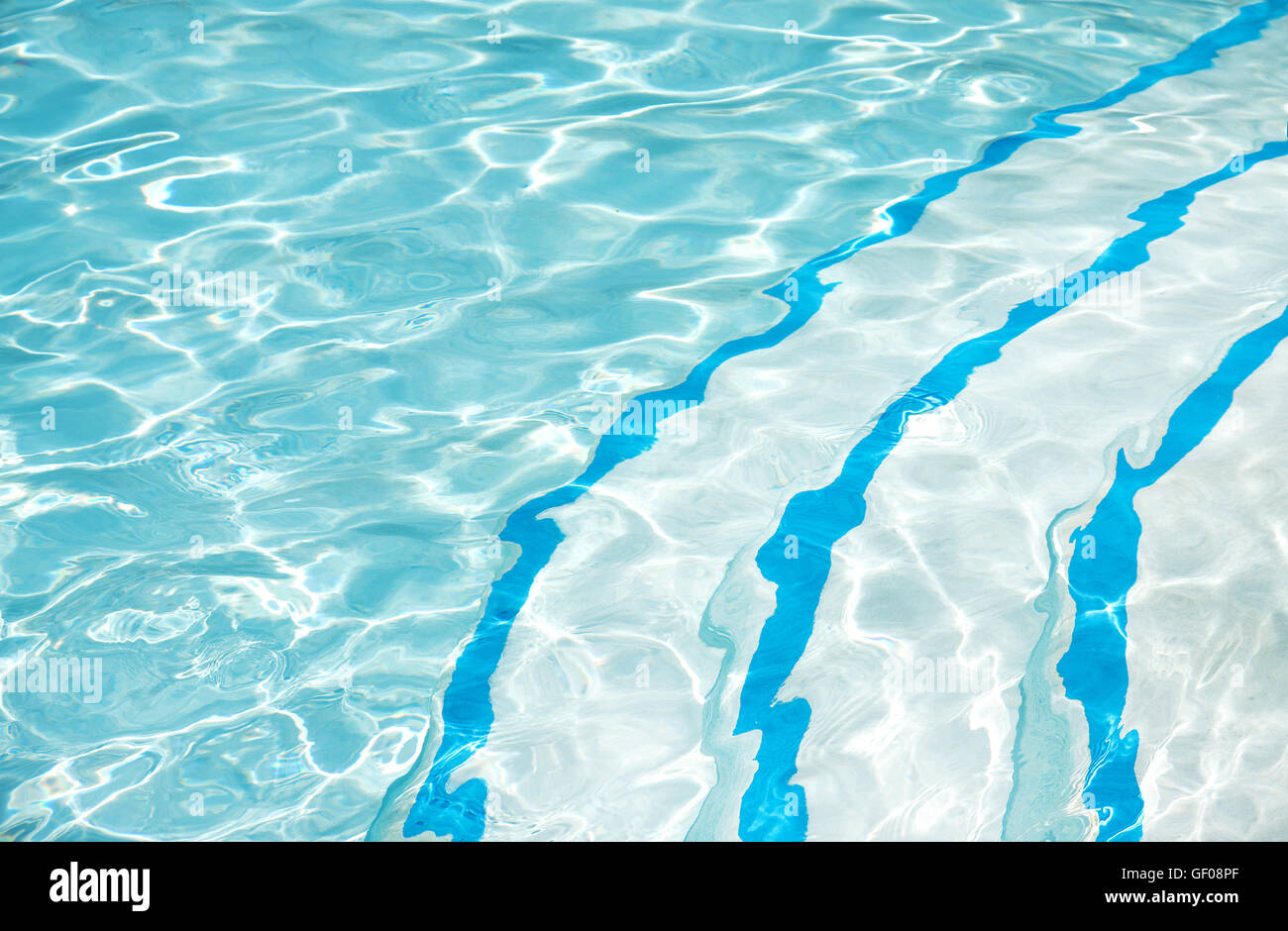 crystal clear blue pool with curved steps ideal for copy space or a ...