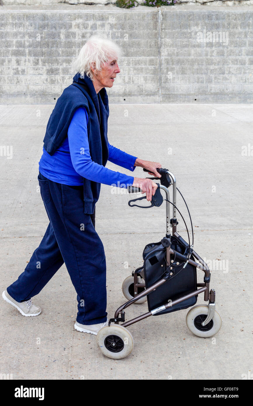 Elderly woman rollator wheeled walker hi-res stock photography and ...