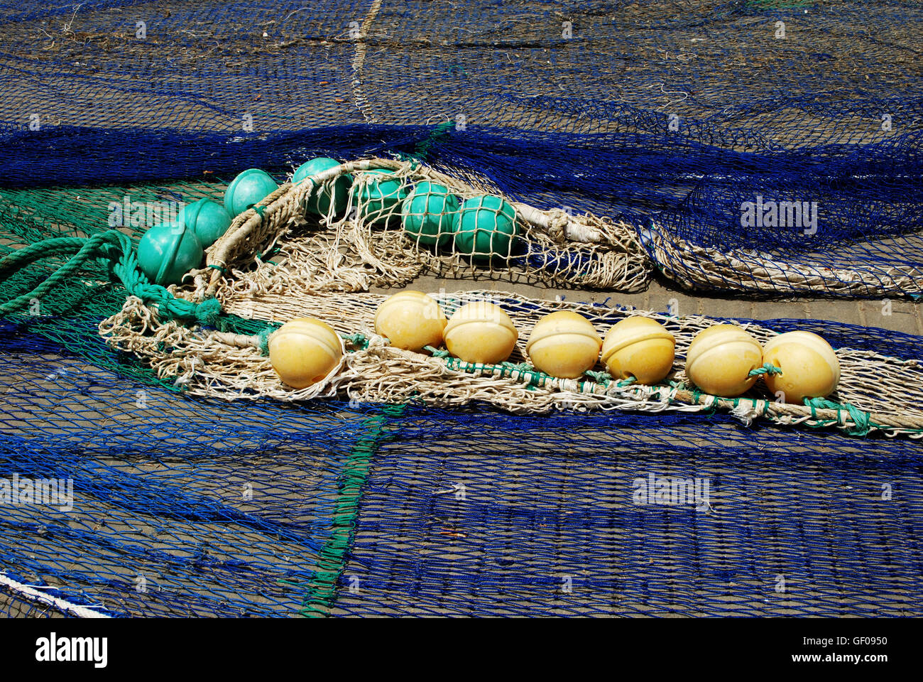 Traditional fishing nets drying in the harbour, Estepona, Malaga ...