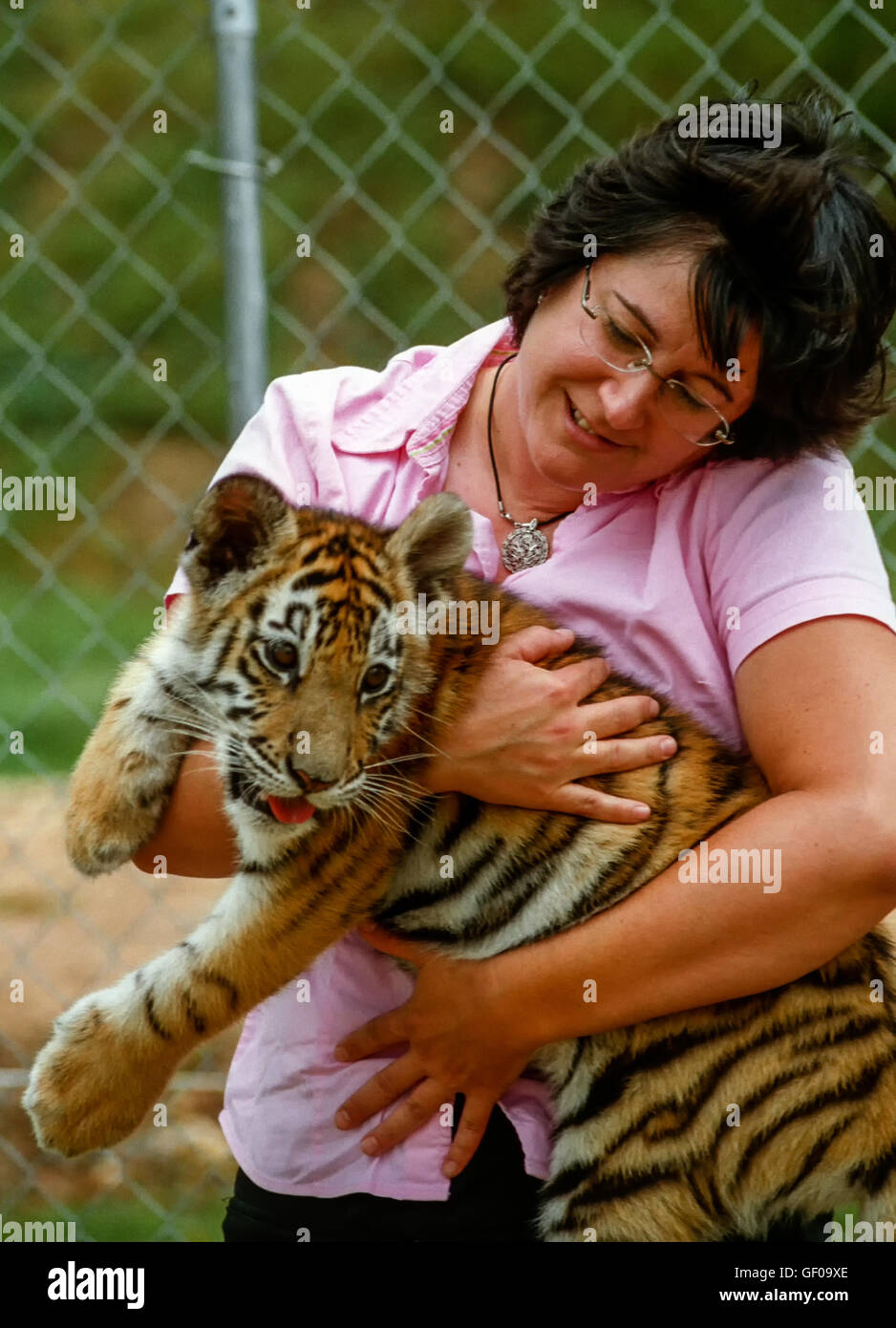 Holding a lion cub hi-res stock photography and images - Alamy