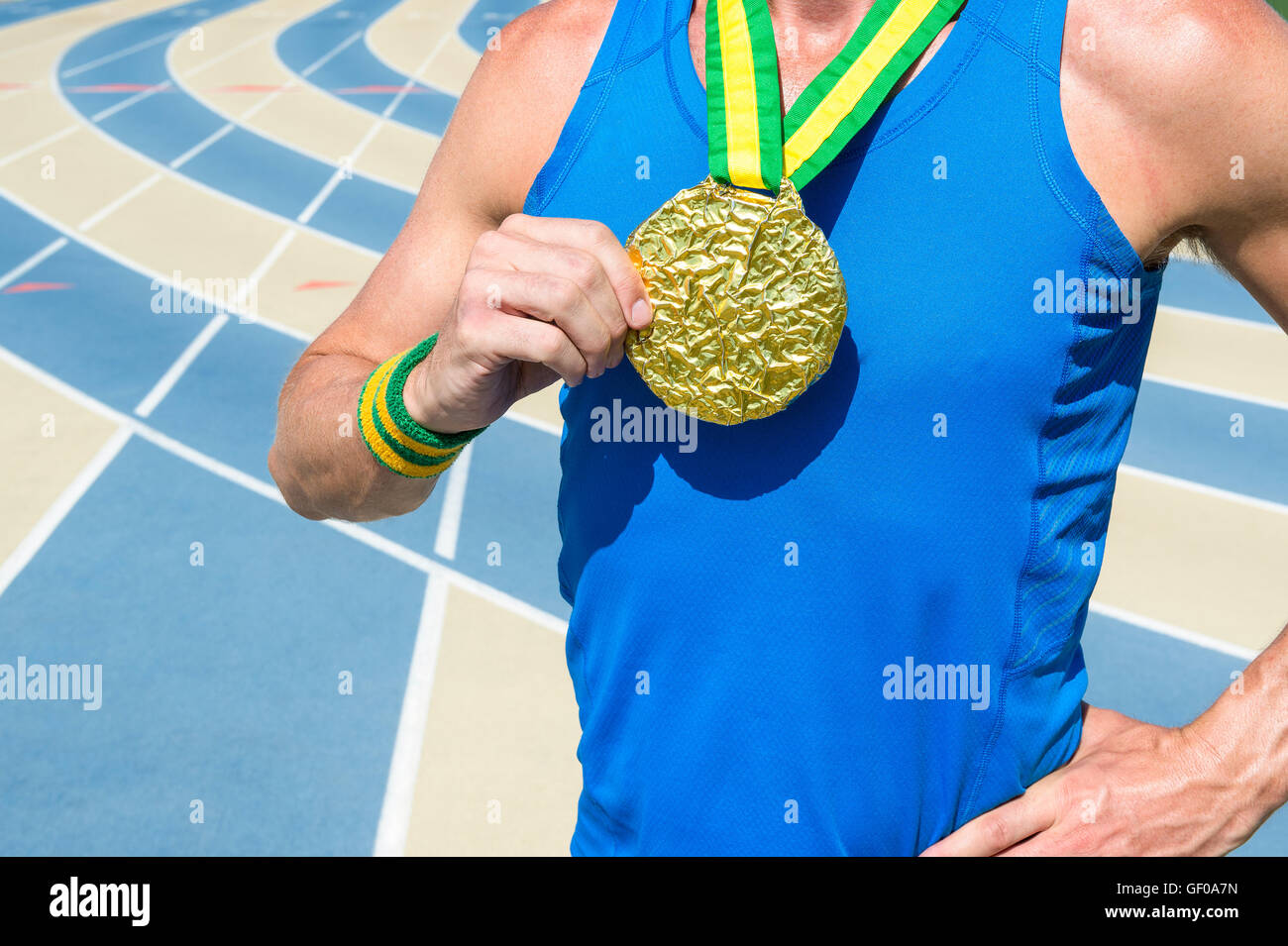 Brazilian athlete standing with gold medal on Brazil colors yellow and ...