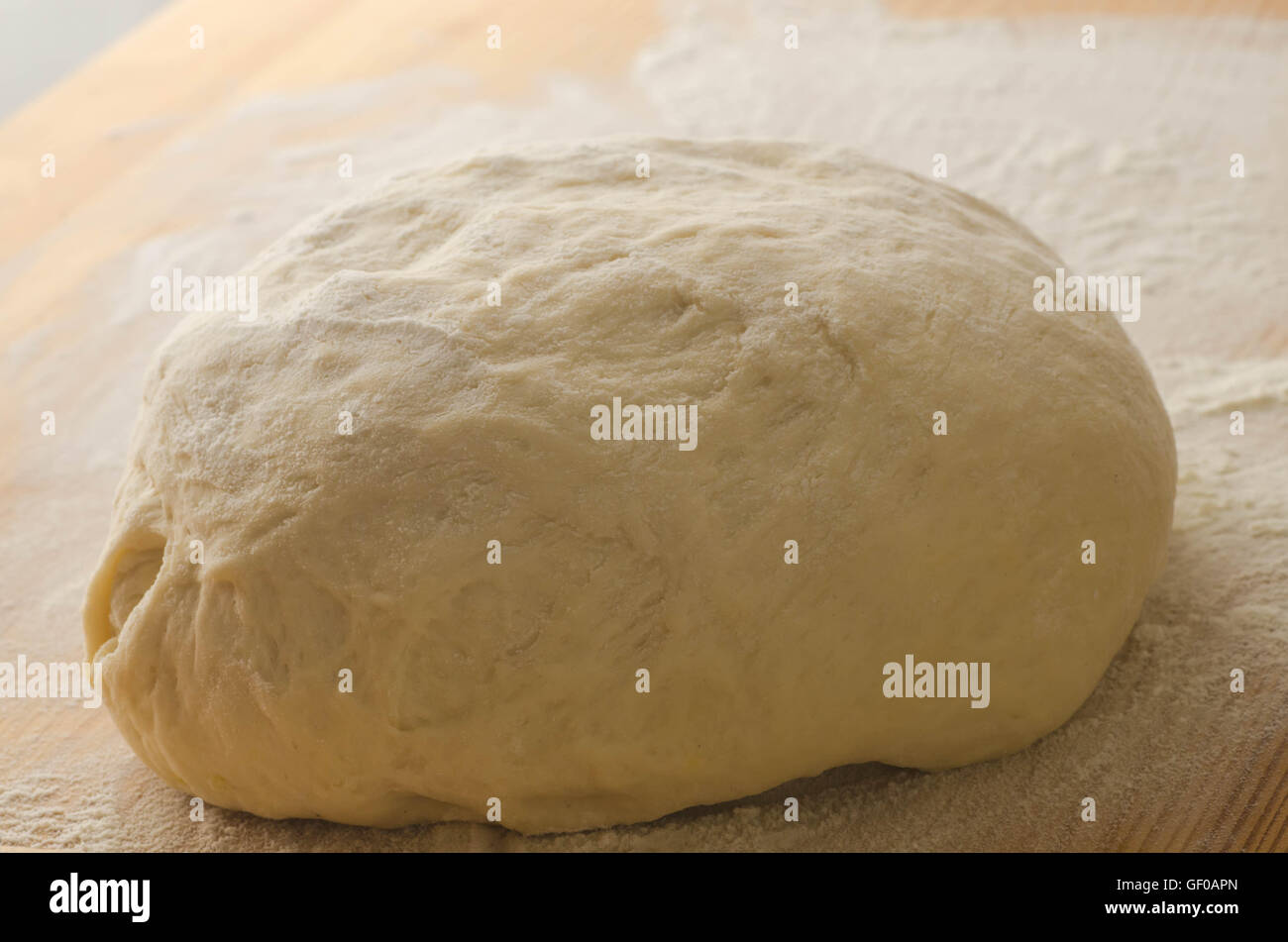 raw dough on wooden pastry board Stock Photo - Alamy