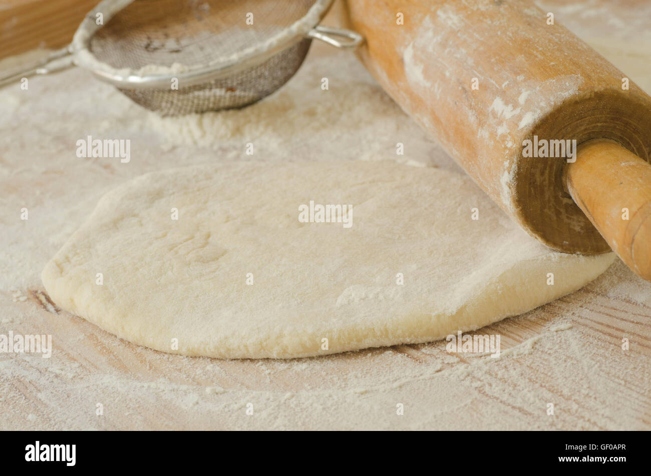 Raw dough wooden rolling pin hi-res stock photography and images - Alamy