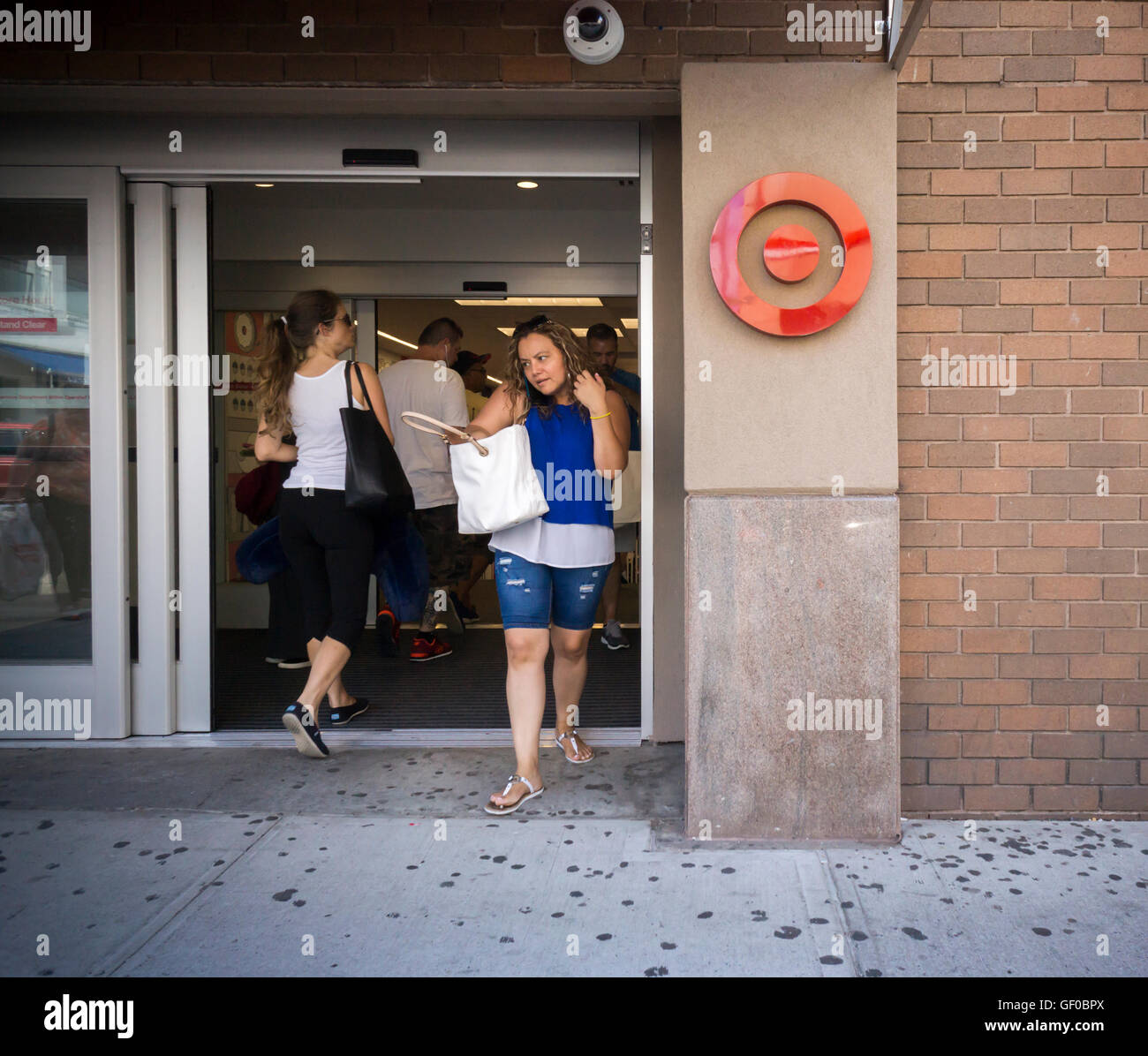 Customers enter and leave a new Target smaller store in Forest Hills in ...