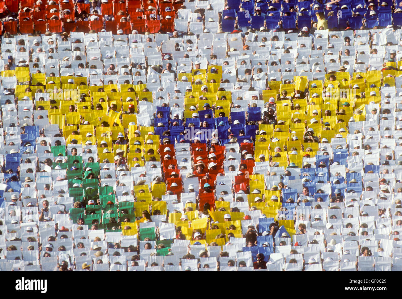 Crowd holding colorful card display in stadium at 1984 Olympic Games in ...