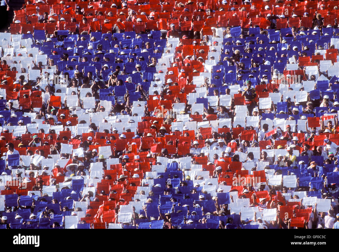 Crowd holding colorful card display in stadium at 1984 Olympic Games in ...