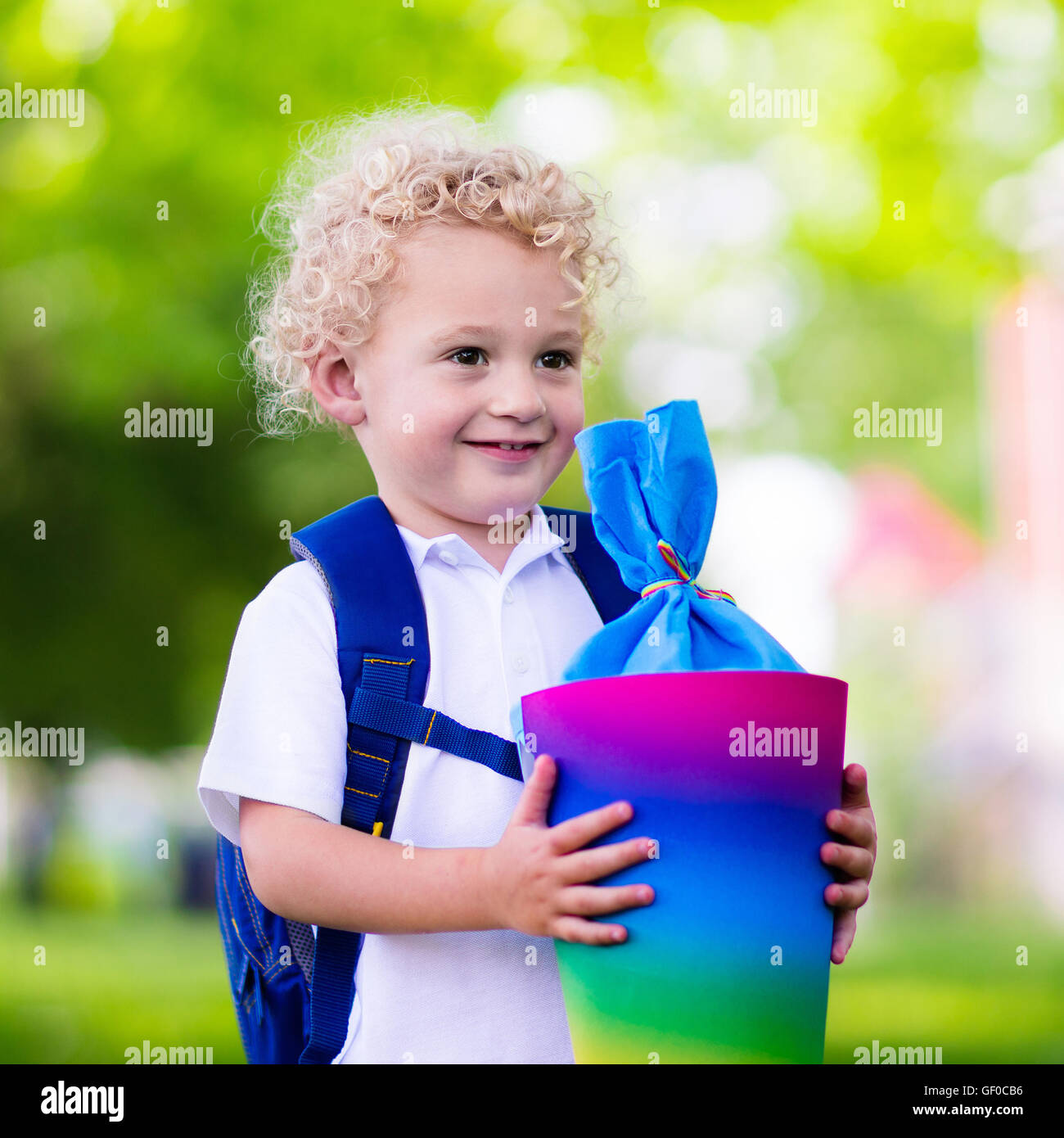 Happy child holding traditional German candy cone on first school day ...
