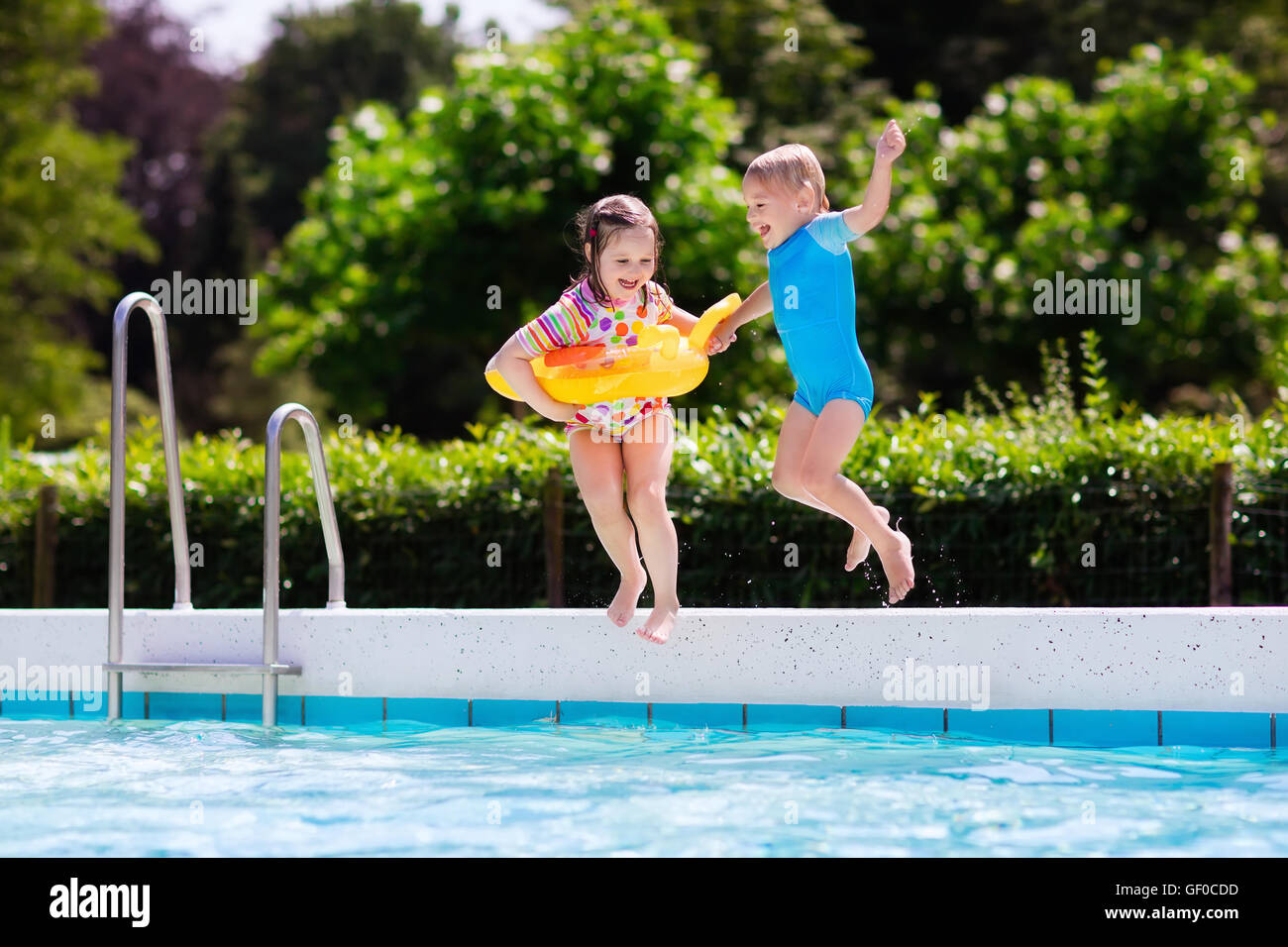 Kids jumping pool summer friends hi-res stock photography and images ...