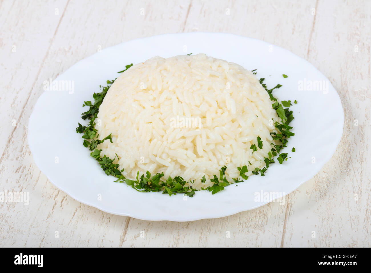 Steamed rice with parsley in the white plate Stock Photo - Alamy