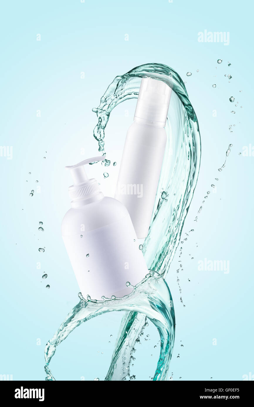 White cosmetic products with water splash on cyan background Stock ...