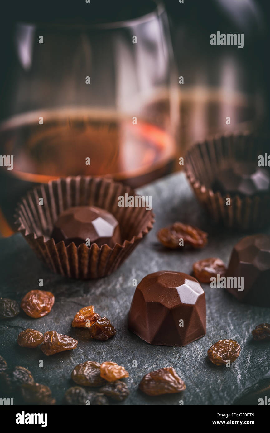 Chocolate sweets on black background Stock Photo - Alamy