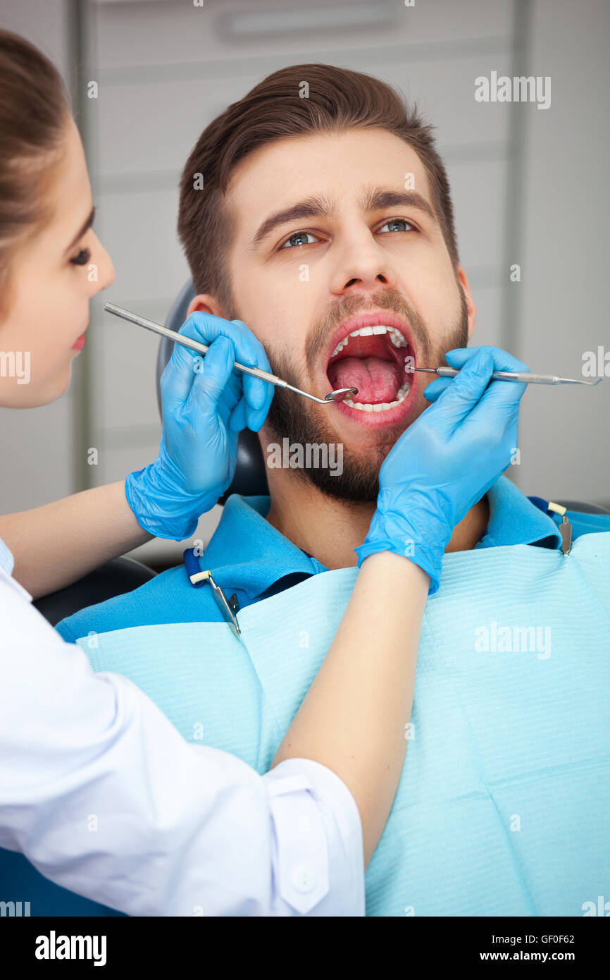 Getting teeth checked hi-res stock photography and images - Alamy
