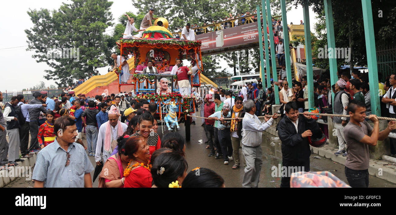 Devotees participate in the pulling of the chariot of Lord Jagannath ...