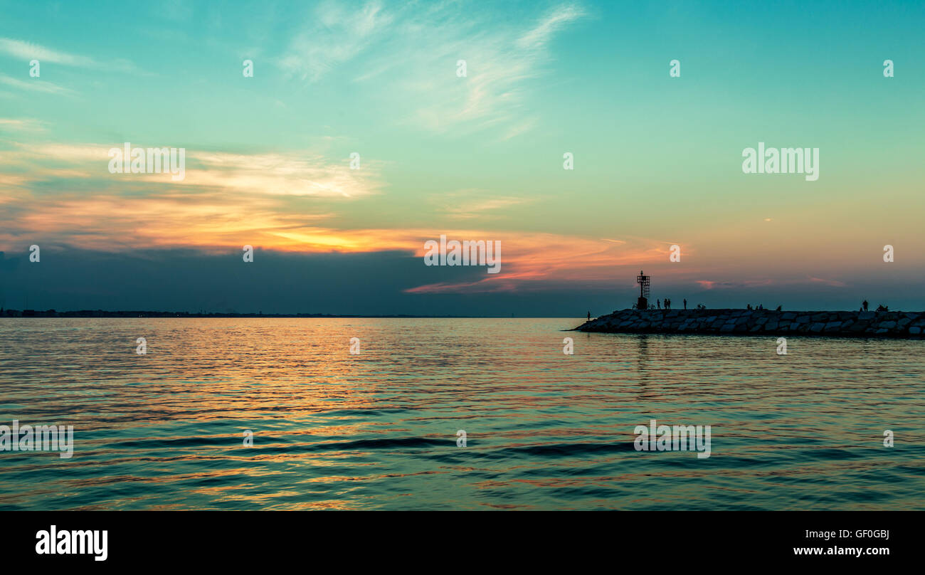 Gold intense sunset over seascape. Rimini Italy Stock Photo - Alamy