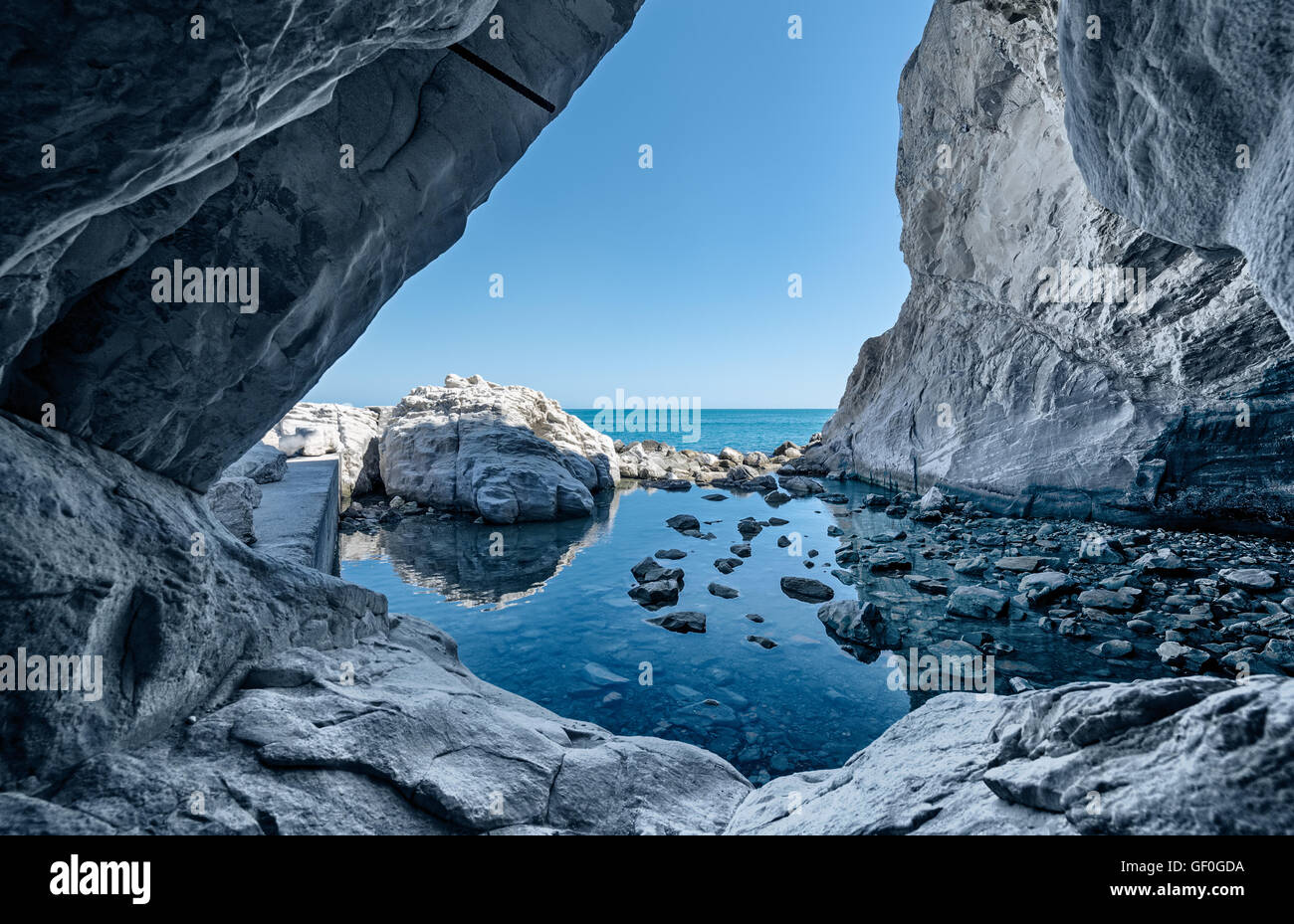 sea cave rocks. Grotto with water reflections Stock Photo - Alamy