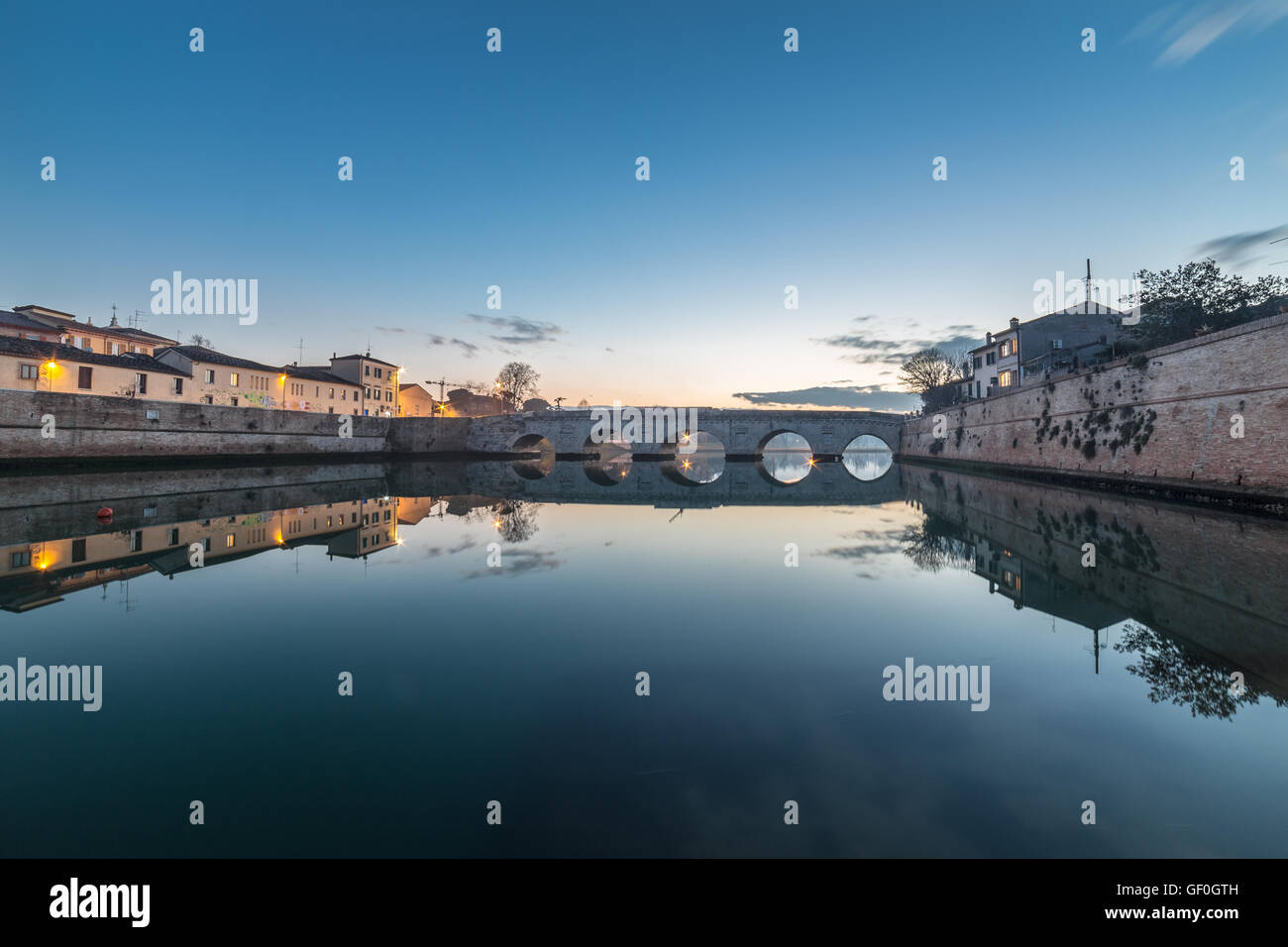 sunset bridge background. Twilight cityscape Rimini Stock Photo - Alamy