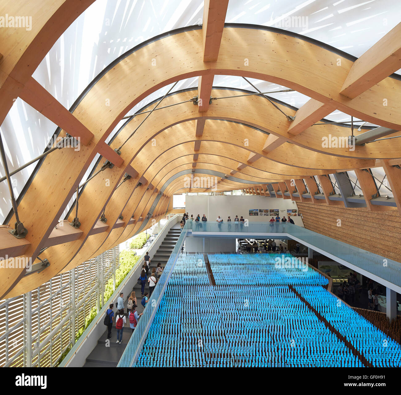 Undulated roof structure with view of ramp and LED installation. Milan ...