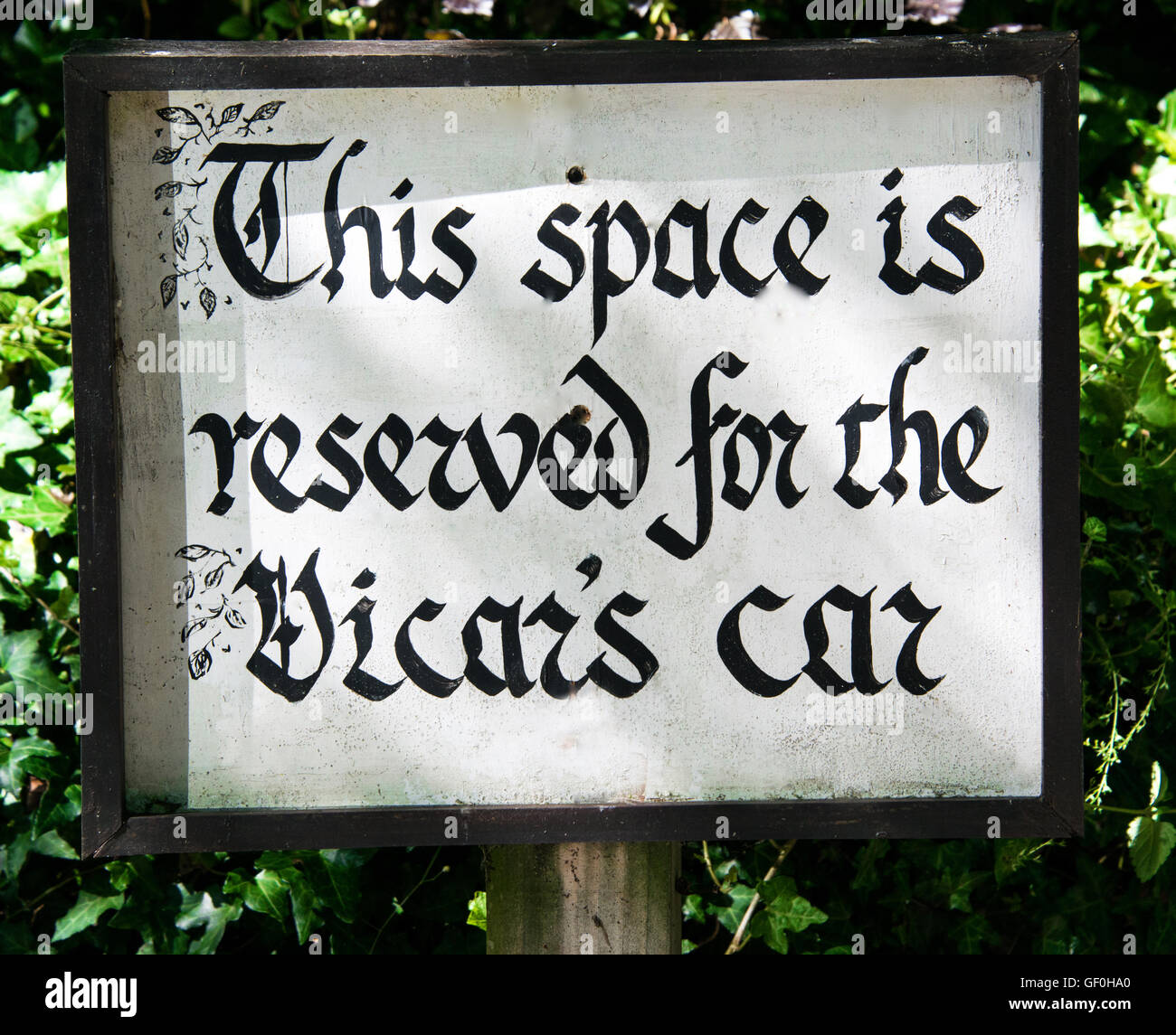 Sign reserving space for 'The vicar's' car Stock Photo - Alamy