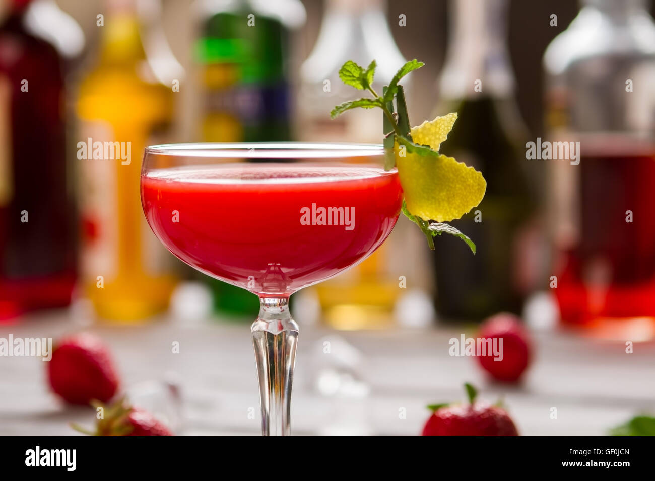 Red beverage in coupe glass Stock Photo - Alamy