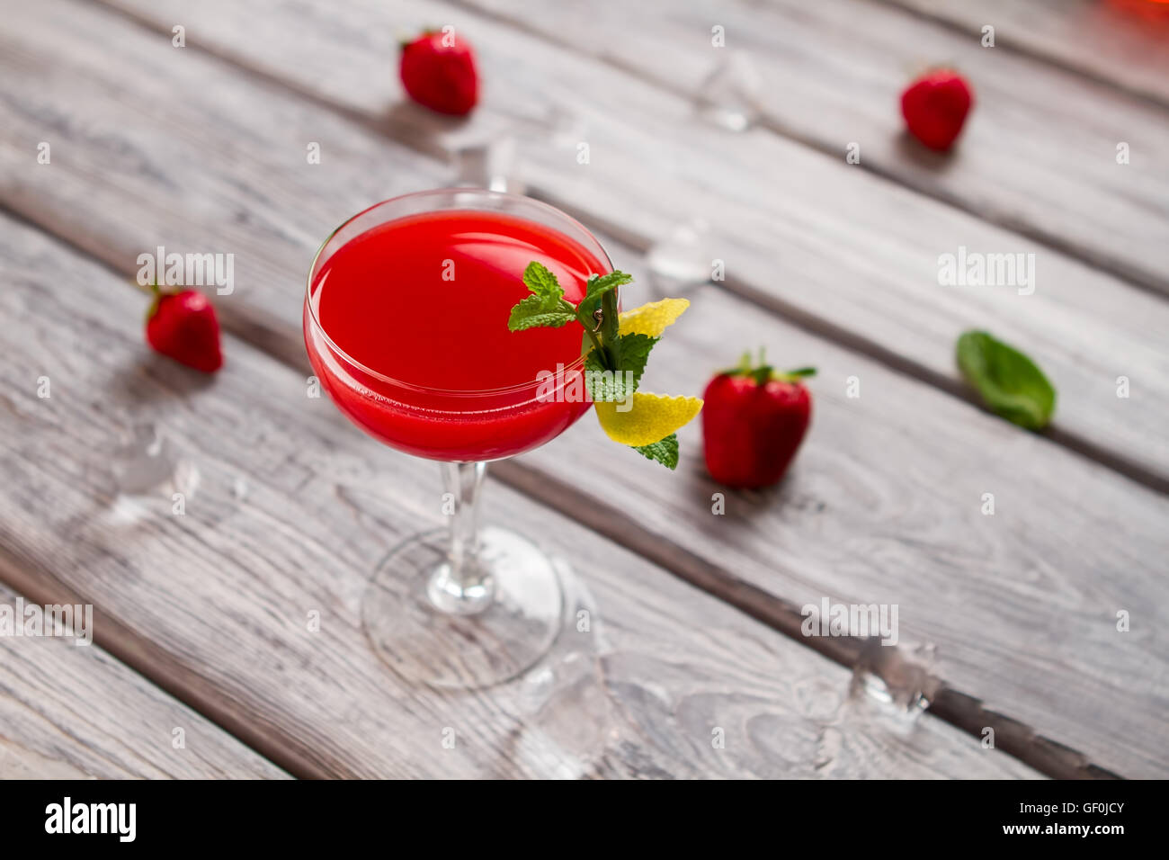 Bright red drink in glass Stock Photo - Alamy