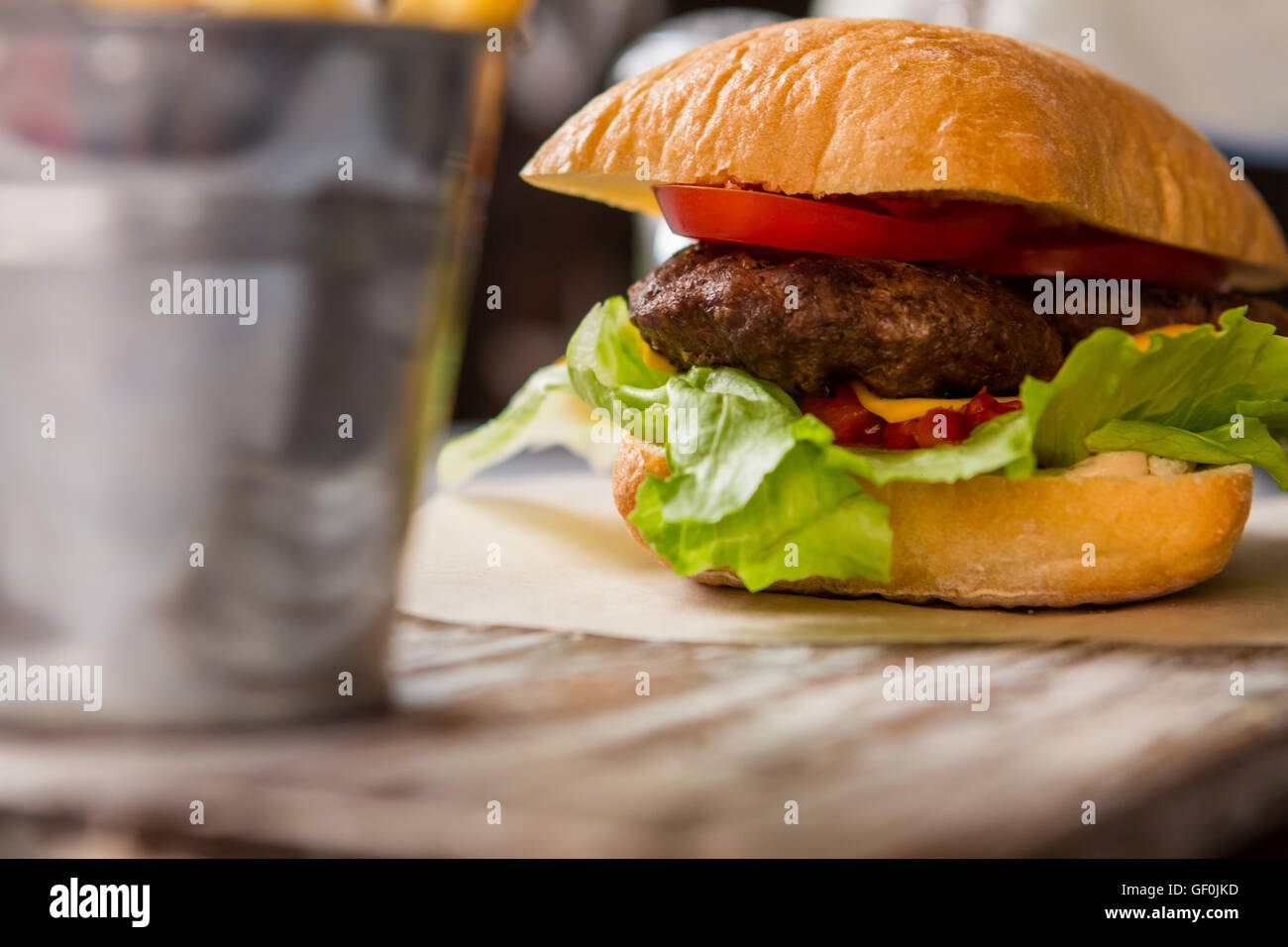 Burger with tomato slices Stock Photo - Alamy
