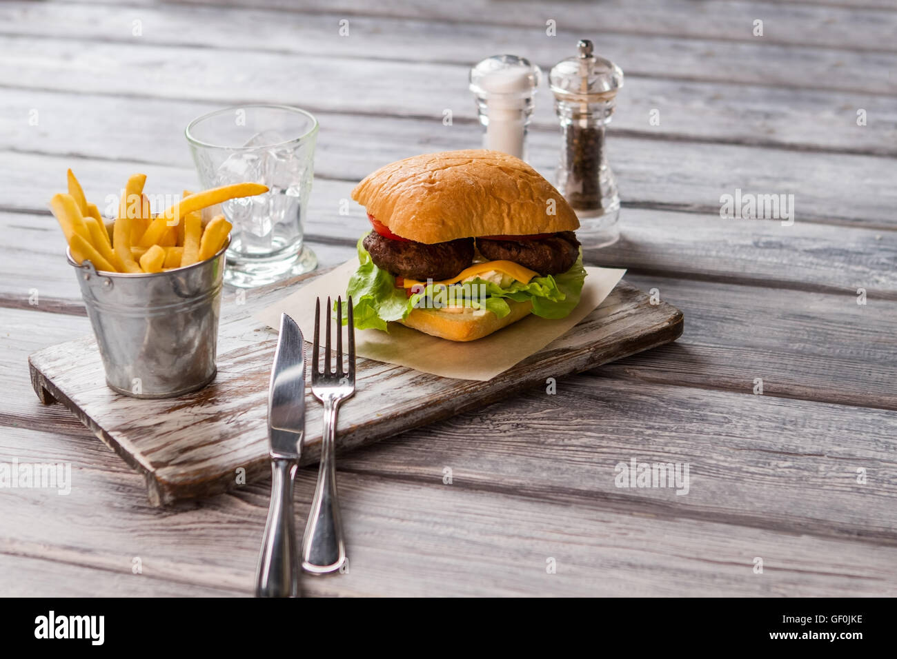 Bucket of fries and cutlery Stock Photo - Alamy