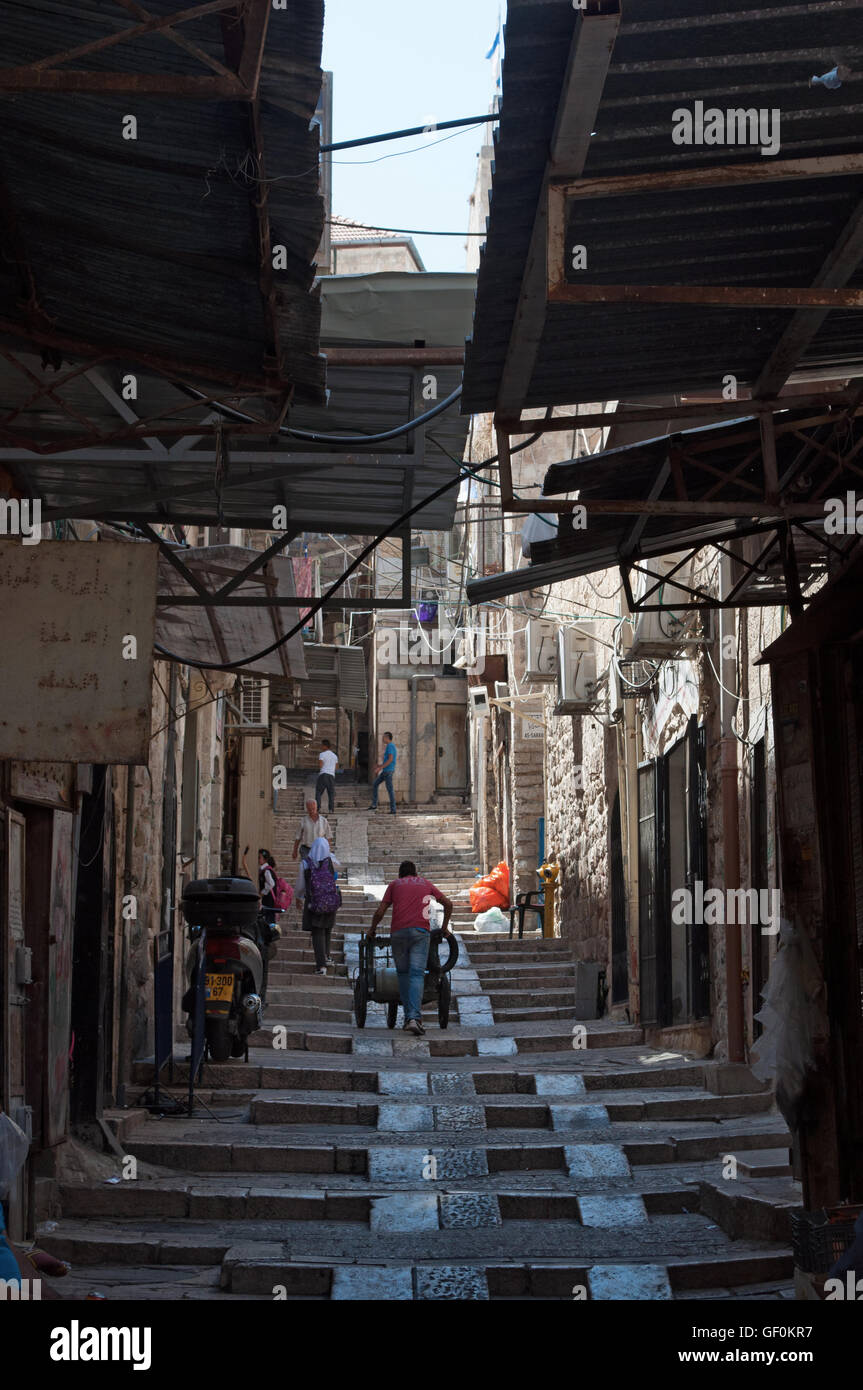 Jerusalem: people in the alleys of the Old City, a walled area in which ...