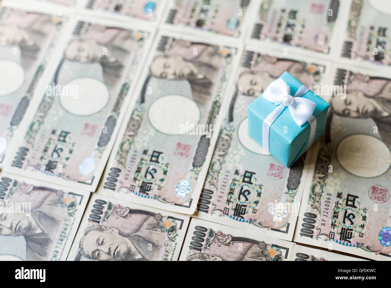 Present box and ten thousands japanese yen bills Stock Photo - Alamy