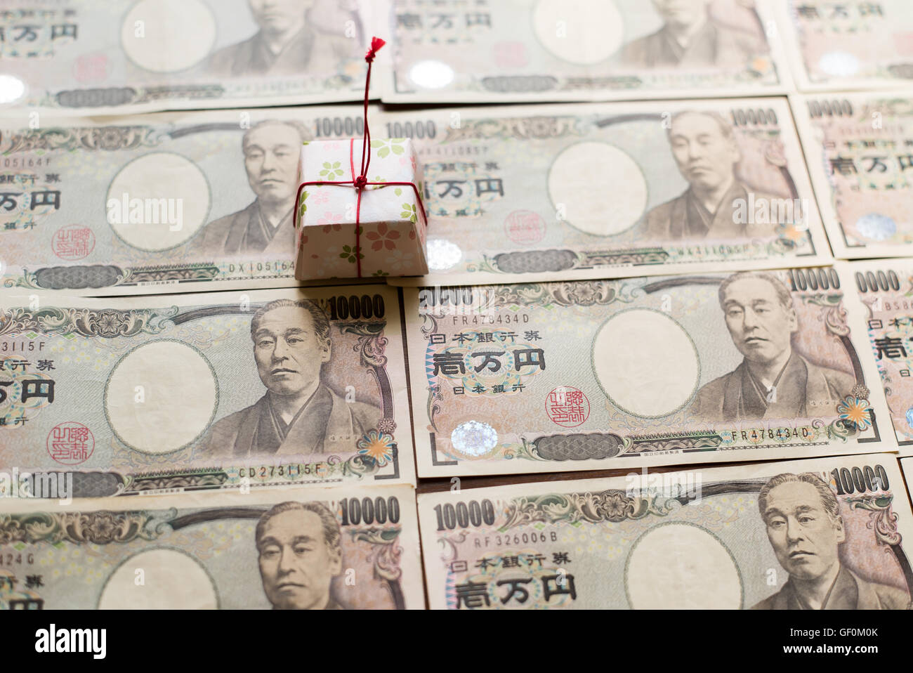 Present box and ten thousands japanese yen bills Stock Photo - Alamy