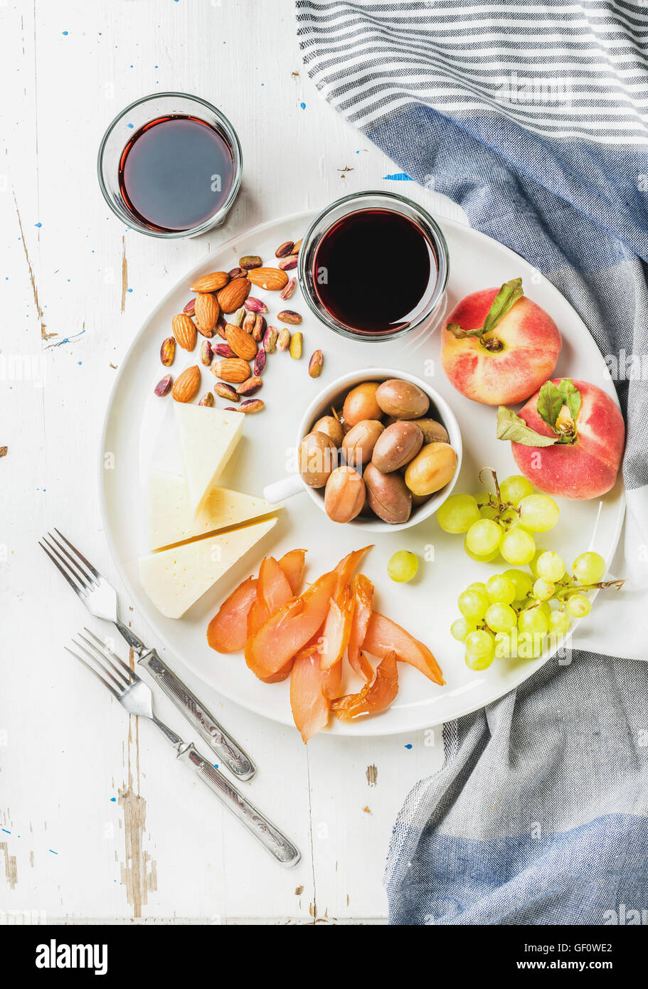 Wine snack set. Cheese, chicken carpaccio, mediterranean olives, fruits ...