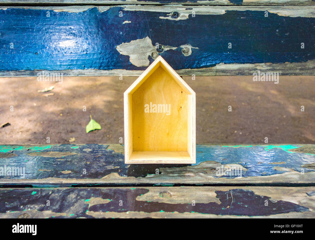 Wooden house on the old bench Stock Photo - Alamy