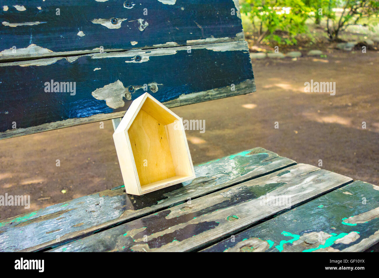 Wooden house on the old bench Stock Photo - Alamy