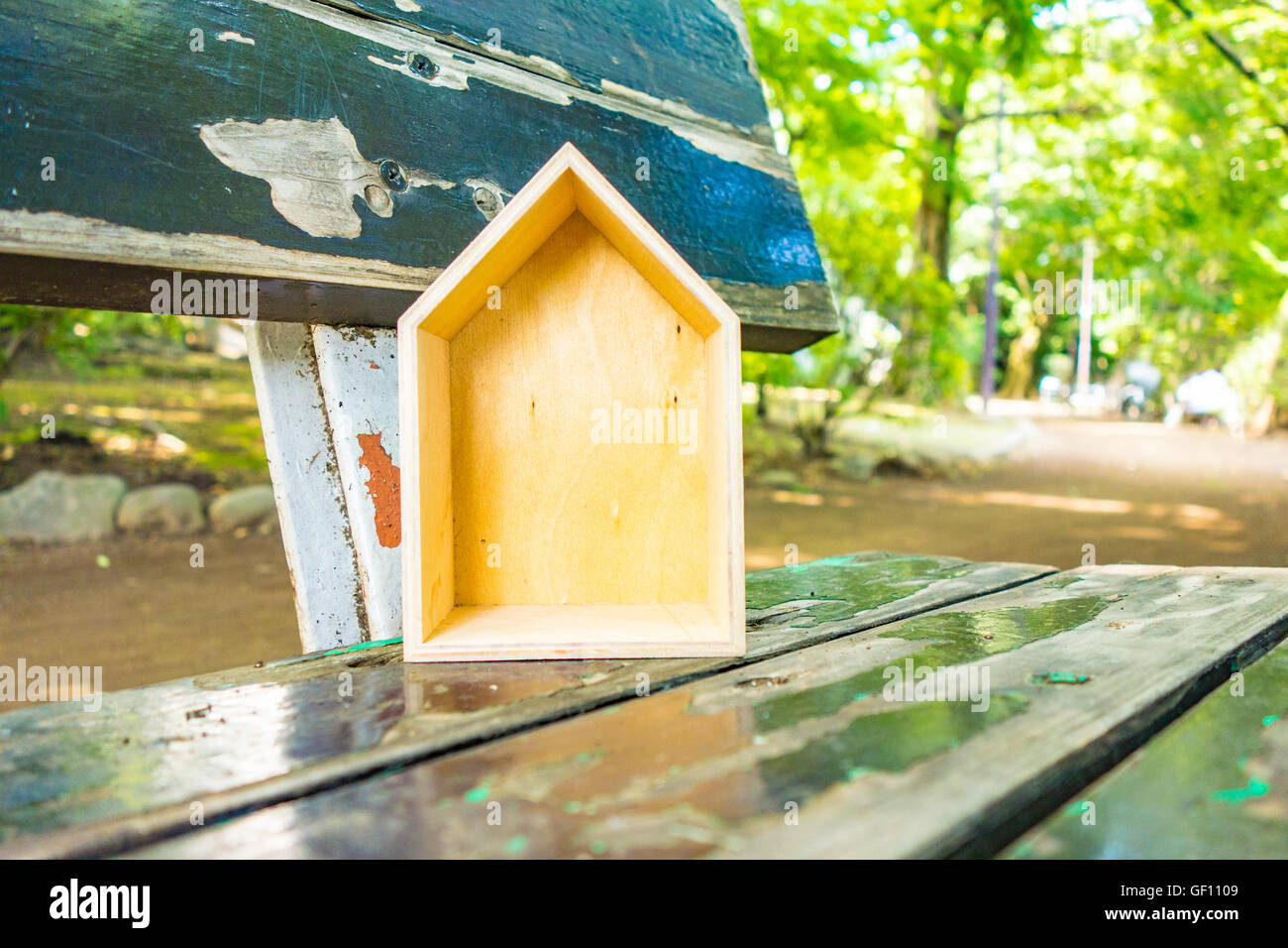 Wooden house on the old bench Stock Photo - Alamy