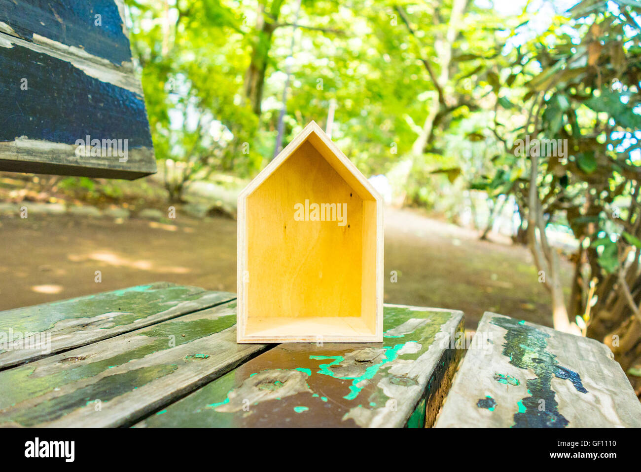 Wooden house on the old bench Stock Photo - Alamy