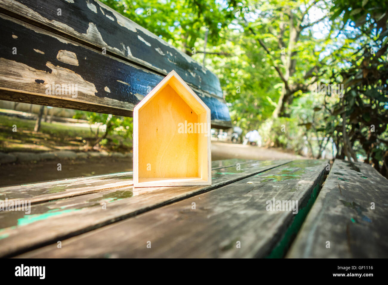 Wooden house on the old bench Stock Photo - Alamy