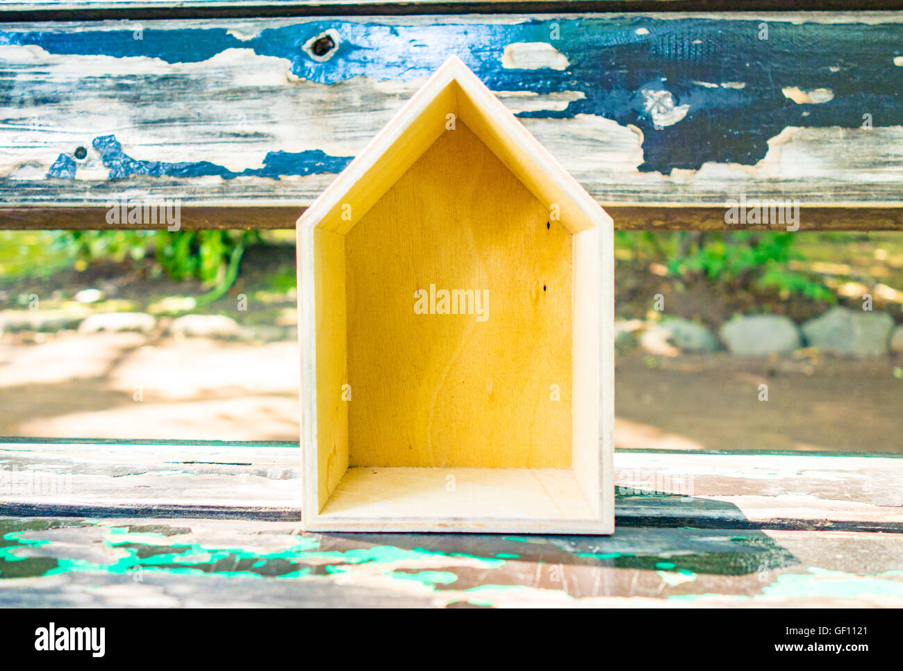 Wooden house on the old bench Stock Photo - Alamy
