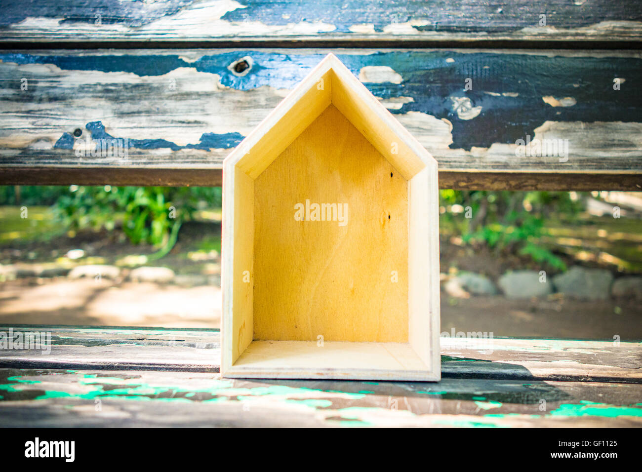 Wooden house on the old bench Stock Photo - Alamy