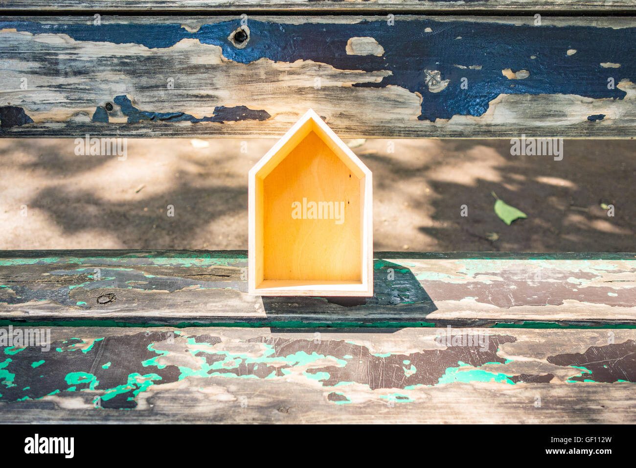 Wooden house on the old bench Stock Photo - Alamy