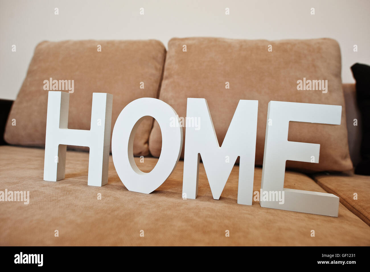 White wooden letters HOME at cofee corner sofa bed at light room Stock ...