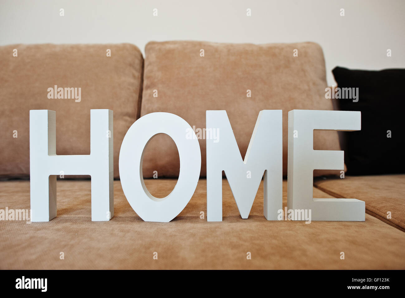 White wooden letters HOME at cofee corner sofa bed at light room Stock ...