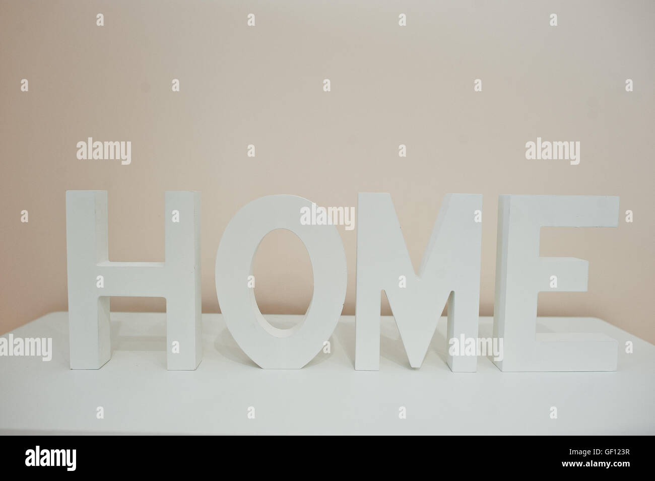 White wooden letters HOME on the shelf Stock Photo - Alamy