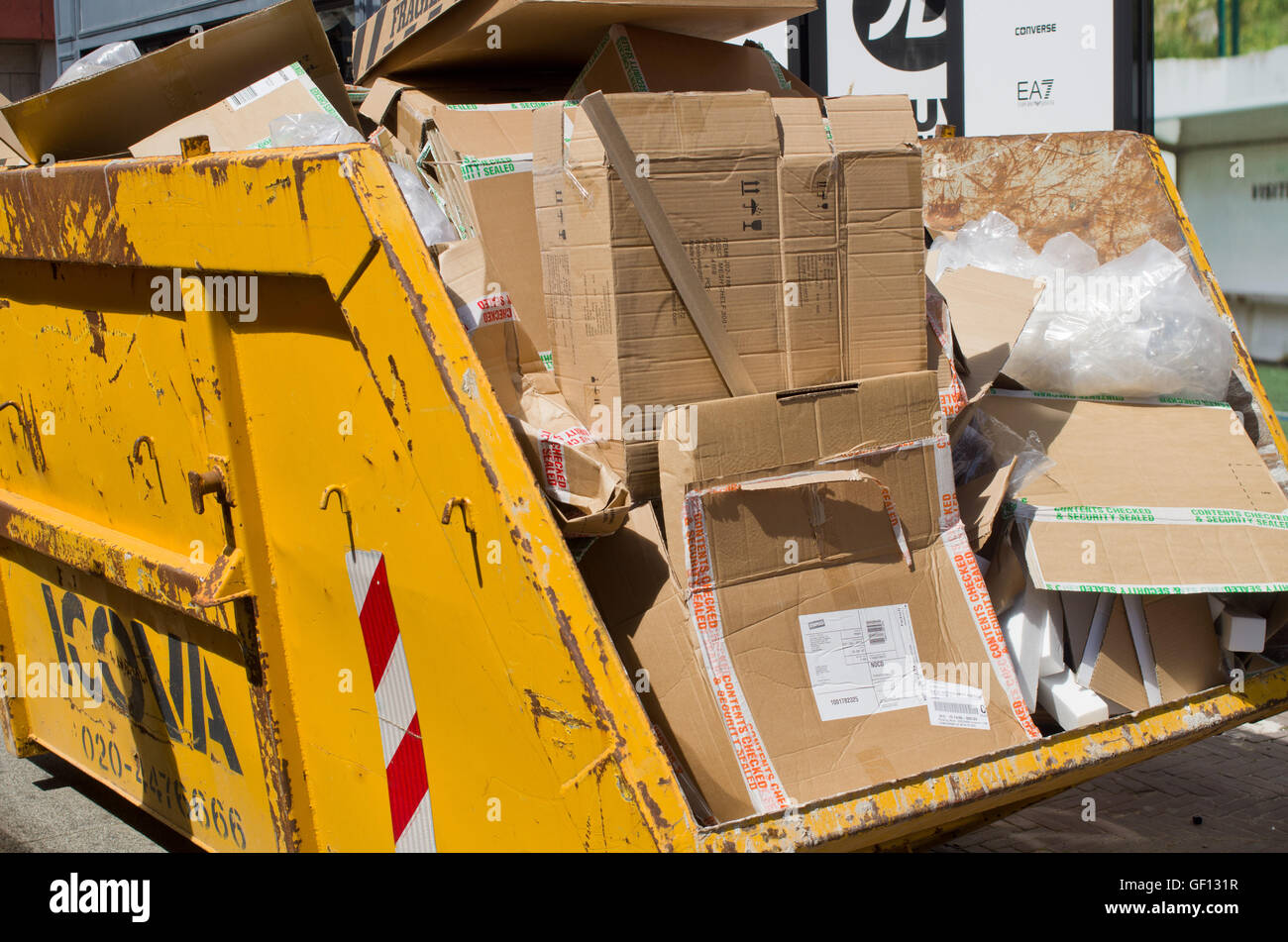 Cardboard boxes in skip Stock Photo - Alamy