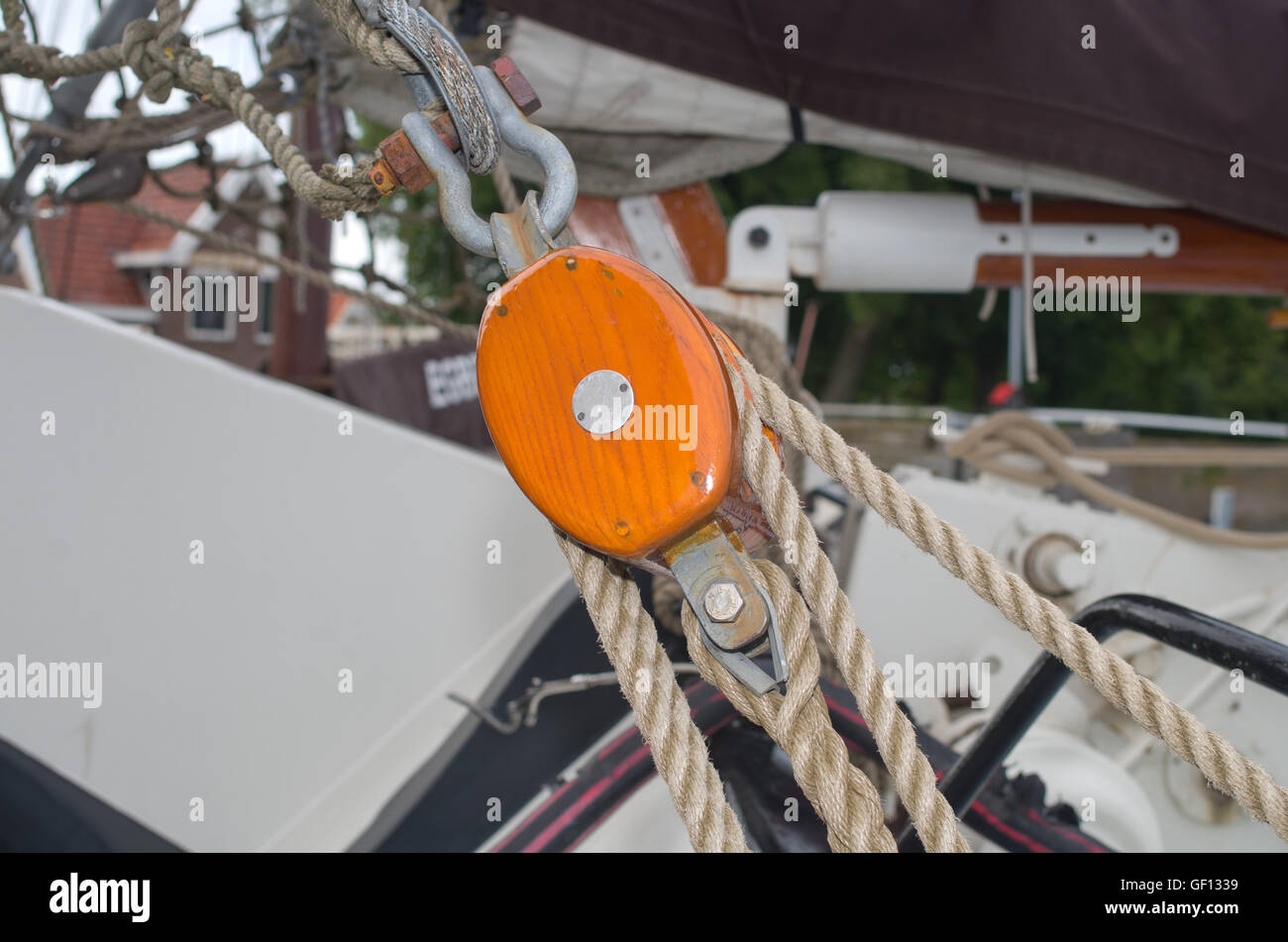 Varnished wooden block, part of traditional rigging Stock Photo - Alamy