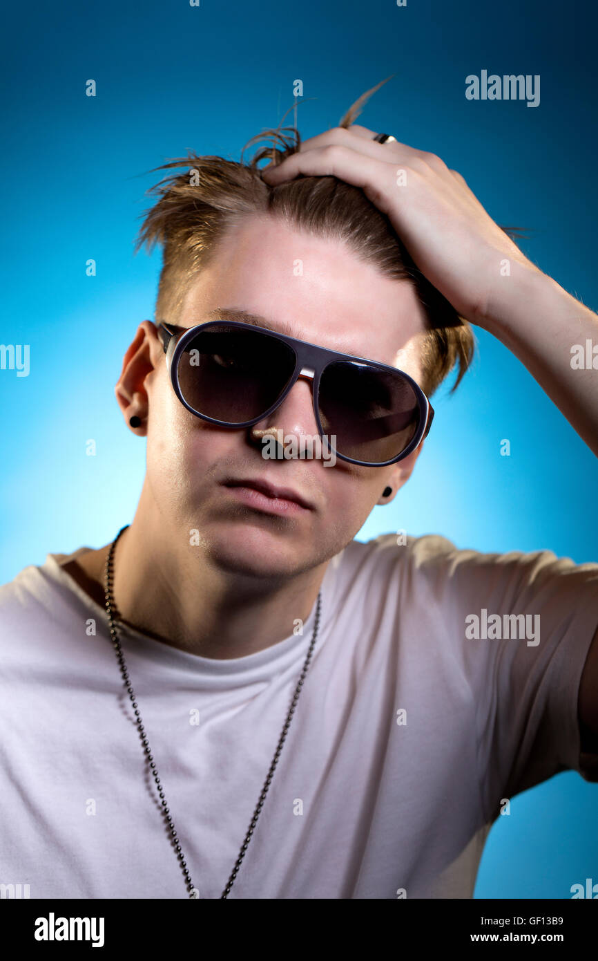 Male model portrait, sunglasses, hair, styling, fashion, blue ...