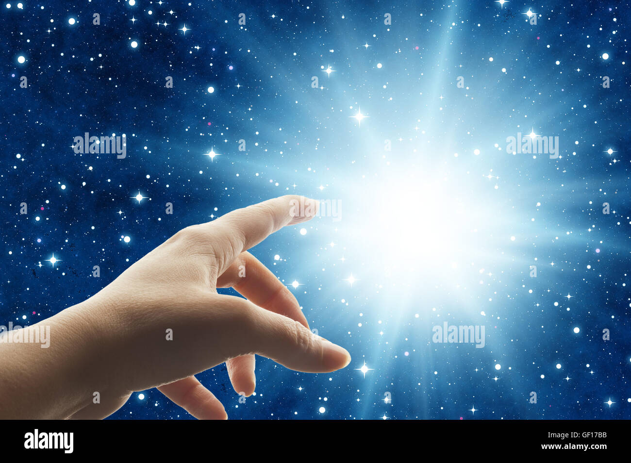 woman hand touching a divine light Stock Photo - Alamy