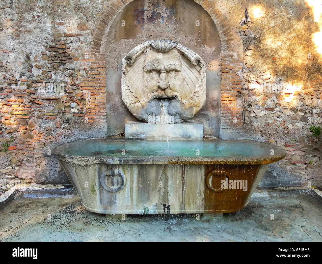 Ancient water spitting fountain in Rome, Italy Stock Photo - Alamy