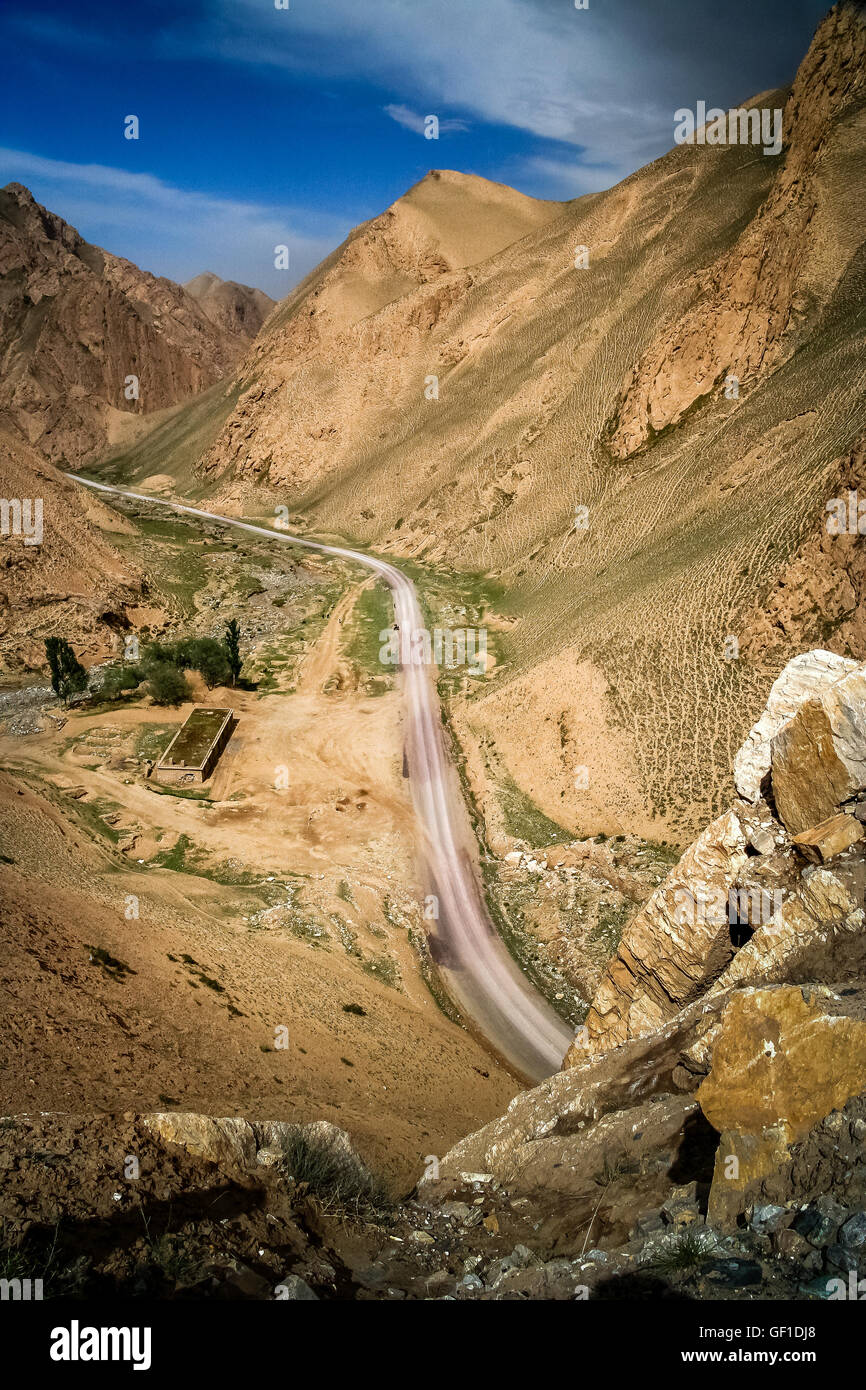 Twisting mountain road in Xinjang province in China leading to Western ...